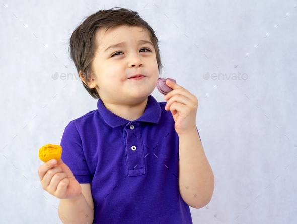 happy kid eating macaroon,Smile Child enjoy his sweet snack ,boy ...
