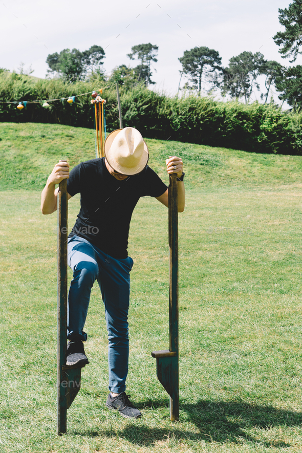 Man balancing himself on walking sticks Stock Photo by wikornr | PhotoDune