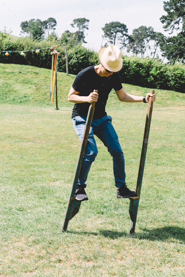 Man trying to balance on walking sticks Stock Photo by wikornr | PhotoDune