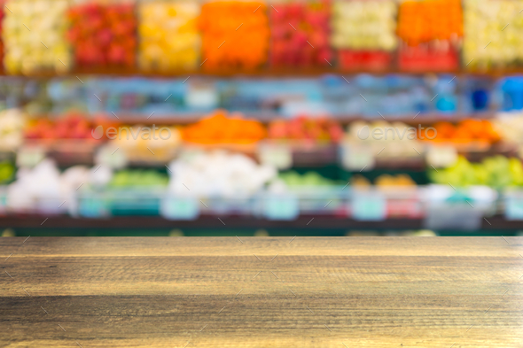 Empty wooden table with blurred fruit shelf in supermarket Stock Photo ...