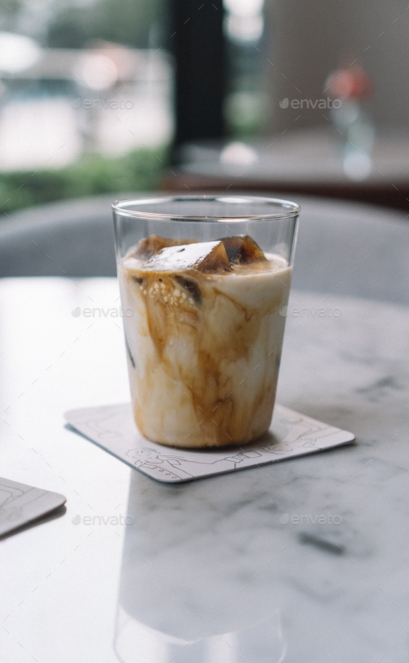 Iced latte with coffee ice cube Stock Photo by wikornr | PhotoDune