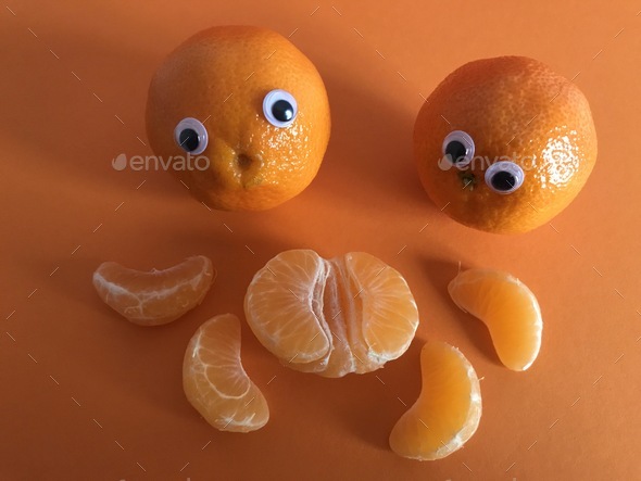 Make food fun, . Two oranges with googly eyes looking at a peeled ...