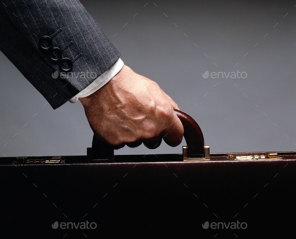 Adult male hand holding a briefcase, with copy space Stock Photo by ...