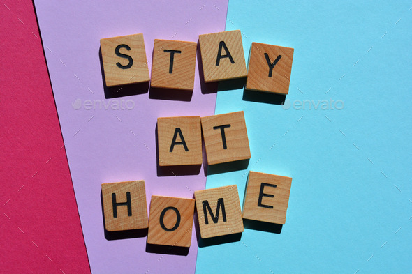 Stay At Home, Words in 3D wooden alphabet letters on colorful ...