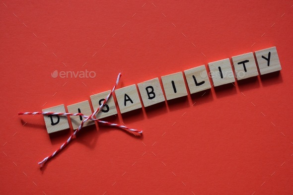 Disability in 3D wooden alphabet letters with Dis crossed out and ...