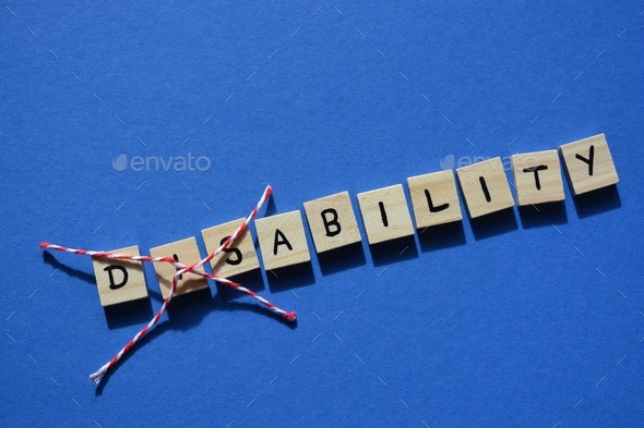 Disability in 3D wooden alphabet letters with Dis crossed out and ...