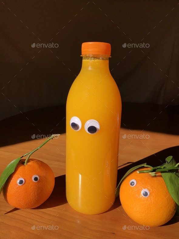 Fresh oranges and fresh lily squeezed orange juice with googly eyes ...