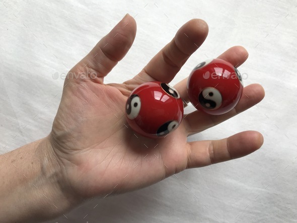 Stress Relief : Woman using Yin Yang or Tai Chi balls Stock Photo by ...