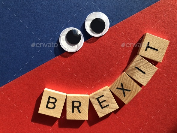 Brexit, word in wooden alphabet letters and googly eyes on red and blue ...