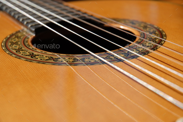 Classical guitar, sound hole and nylon strings, close up Stock Photo by ...