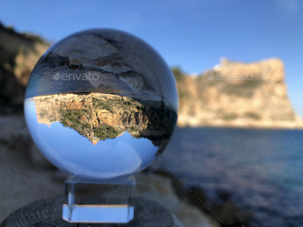 Crystal ball, refraction photography. Coastal view, cliffs and sea ...