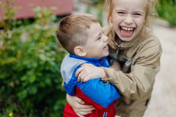 Two kids playing and having fun outdoors, countryside life Stock Photo ...