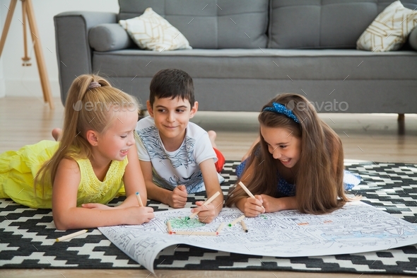 Gen z children play and draw on coloring book Stock Photo by olesyaklyots
