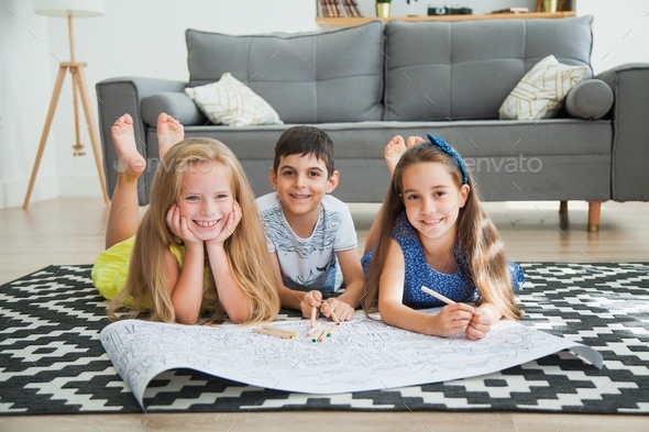 Gen z children play and draw on coloring book Stock Photo by olesyaklyots