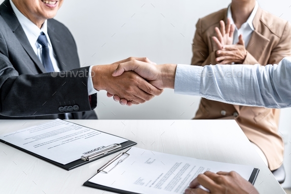 male candidate shaking hands with Interviewer or employer after a job ...