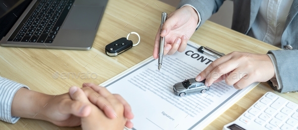 Car dealer manager presenting customer signing car document contract ...