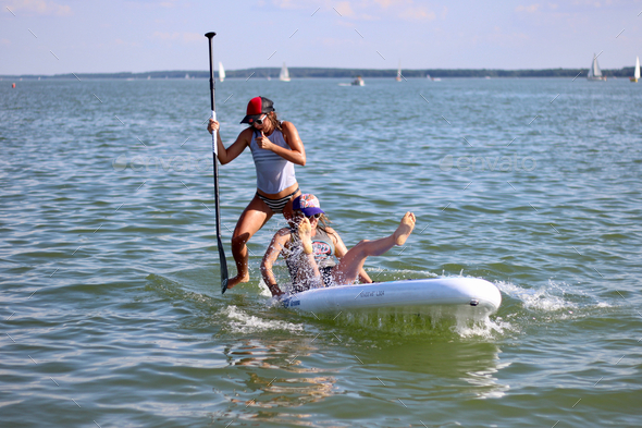 People have fun . Sup, summertime, outdoors, lake, lakeside, activity ...