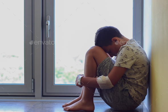 Stressed boy, depression in a child. A boy in the hospital. Stock Photo ...