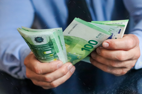 Money. Hands holding money, euro, euros, counting money, saving ...