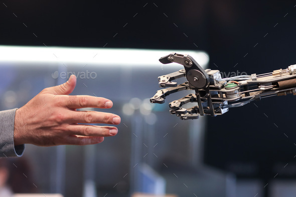 a touch or a handshake, a robot of the future,new technology, science ...