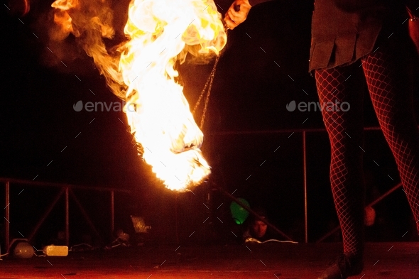 ↟ Fire show. Fire dancer dances. Night performance. Dramatic portrait ...