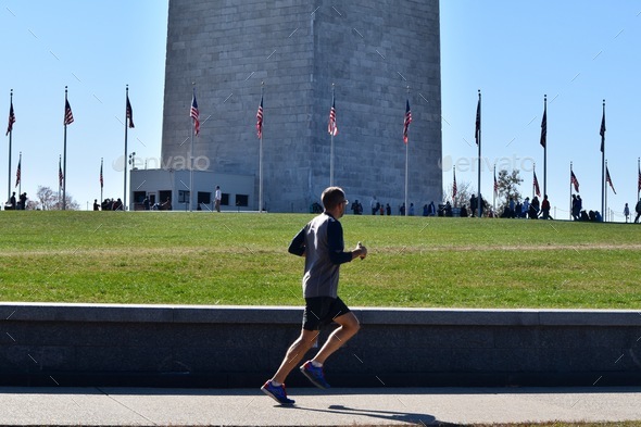Adults running: man running along the path in front of the Washington ...
