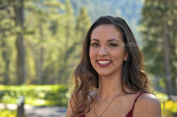 Nominated Beautiful happy young millennial in a red dress smiling and ...
