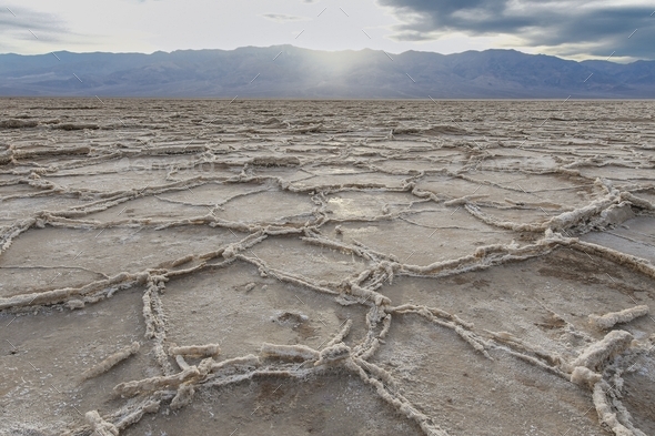 Salt cracks at sunset golden hour at Badlands salt flats Death Valley ...