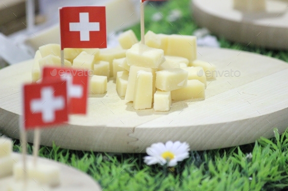 Samples of Swiss cheese on a cheese board for tasting Stock Photo by ...