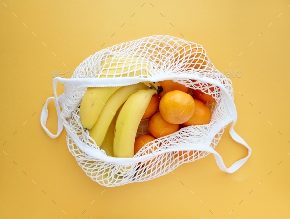 Fresh fruit in a white reusable string shopping bag - eco friendly ...