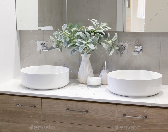 Twin circular hand washing basins in the bathroom vanity Stock Photo by ...