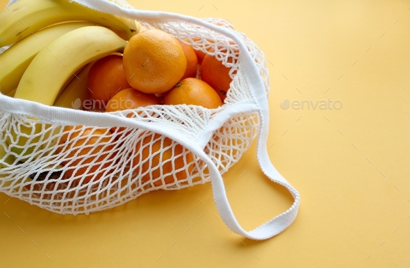 Fresh fruit in a white reusable string shopping bag - eco friendly ...
