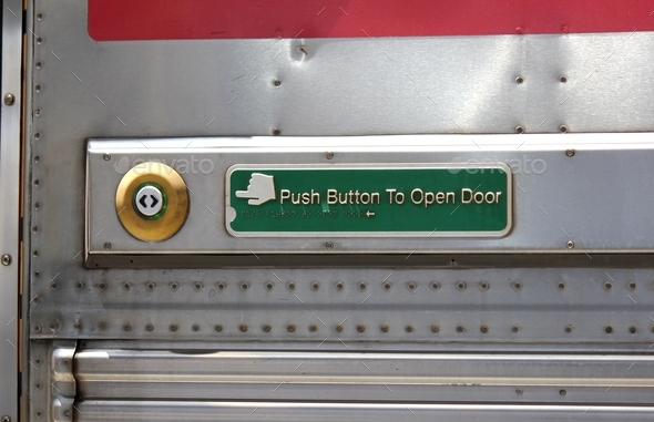 Sign on a train - push button to open door Stock Photo by iheartcreative