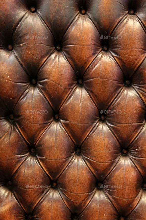 Texture and background of an antique Chesterfield sofa made of worn ...