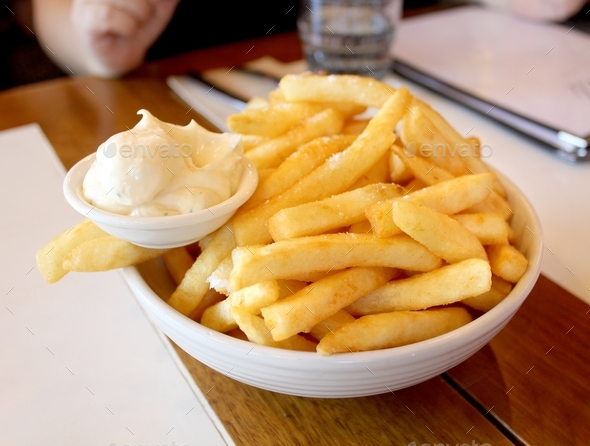French fries with garlic aioli sauce on the side Stock Photo by ...