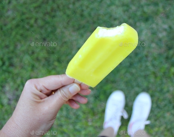 Me enjoying a lemon Splice ice cream popsicle Stock Photo by iheartcreative