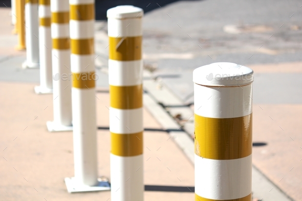 Depth of field, striped poles or bollards Stock Photo by iheartcreative