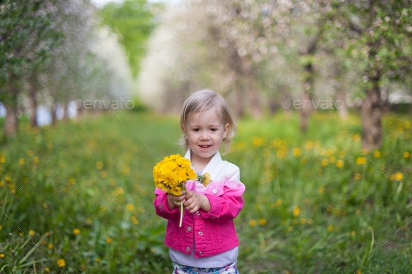 little girl in spring flowers Stock Photo by Yuliya_Kokosha | PhotoDune