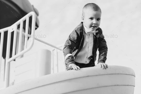 little boy riding a roller coaster in an amusement park Stock Photo by ...