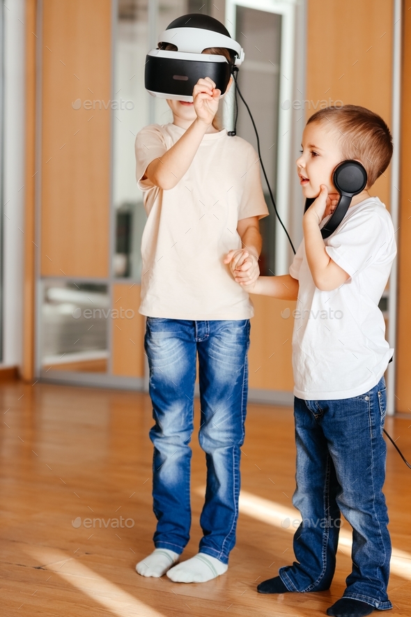 Kids playing a video game Stock Photo by IrinaG1504 | PhotoDune
