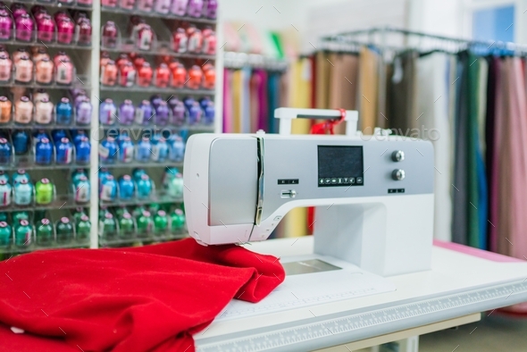 Electric sewing machines in the showroom of textile store against the ...