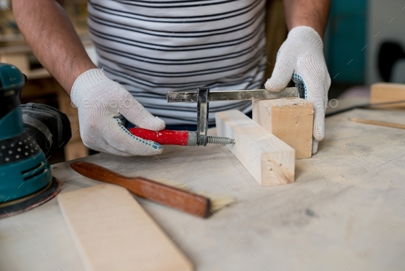 Man working in workshop. Joinery work on the production and renovation ...