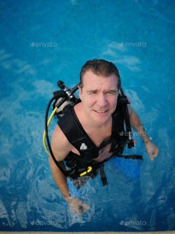 Man is wearing scuba gear, ready for adventure and water fun activity ...