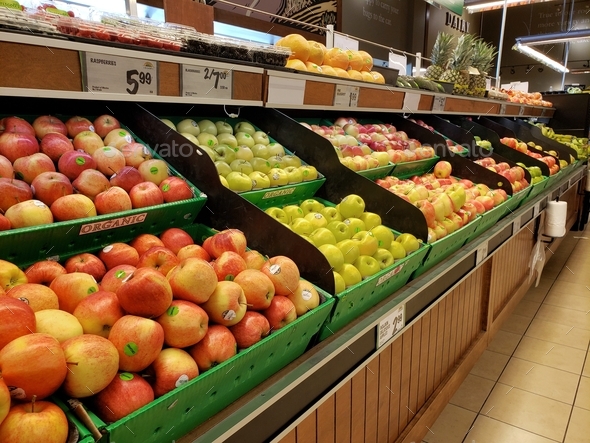 Fresh produce store displays attractive fruits, different varieties of ...
