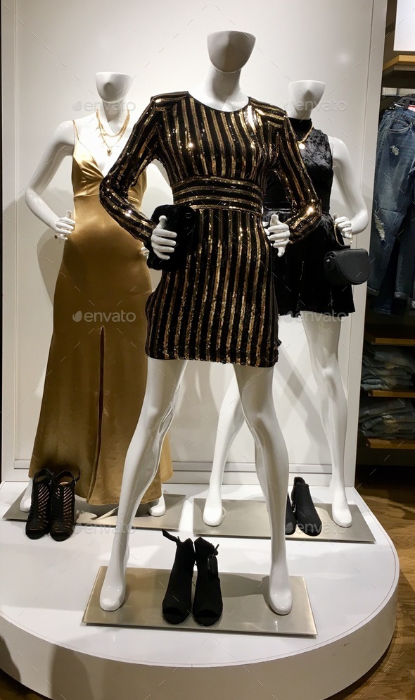 Glamorous shiny outfits displayed on mannequins Stock Photo by polga2