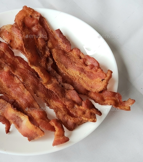 Plate of crispy cooked bacon strips Stock Photo by polga2 | PhotoDune