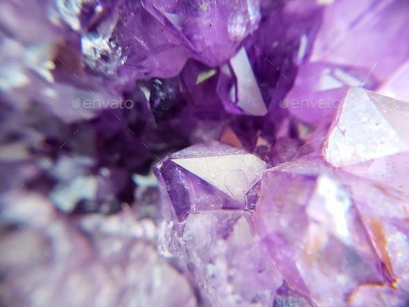 Purple Amethyst crystals close up, natural structure with facets ...