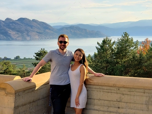 Beautiful young couple visiting countryside Stock Photo by polga2