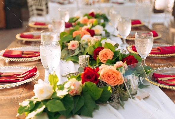 Romantic tablescape with red roses table setting for wedding event ...