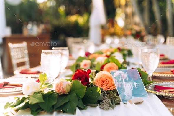 Romantic tablescape with red roses table setting for wedding event ...